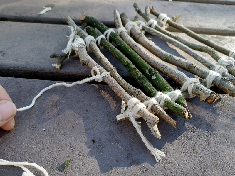 Outdoor craft – build a raft with sticks – Crafty Messy Mom