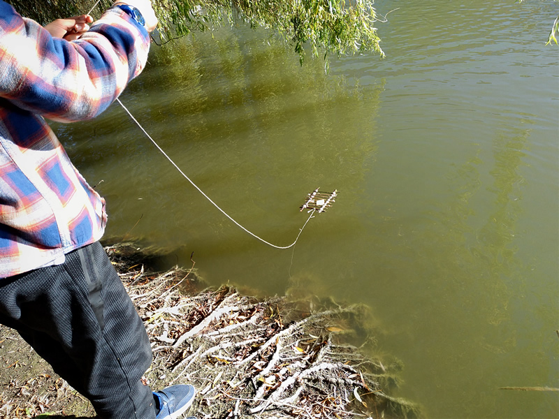 Outdoor craft – build a raft with sticks – Crafty Messy Mom